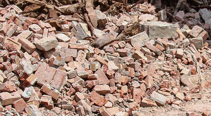 Six workers got trapped under the debris of a wall that collapsed at a ...