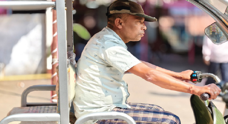 Gram Panchayat member Atin drives a Toto to public relations